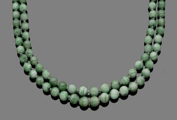 Bonhams : A double row treated jade bead necklace