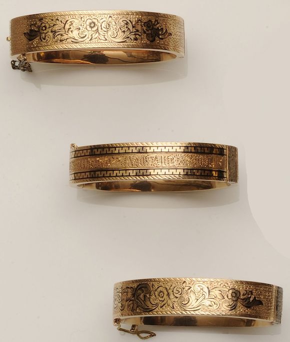 Bonhams : A collection of three enamelled bangles (3)