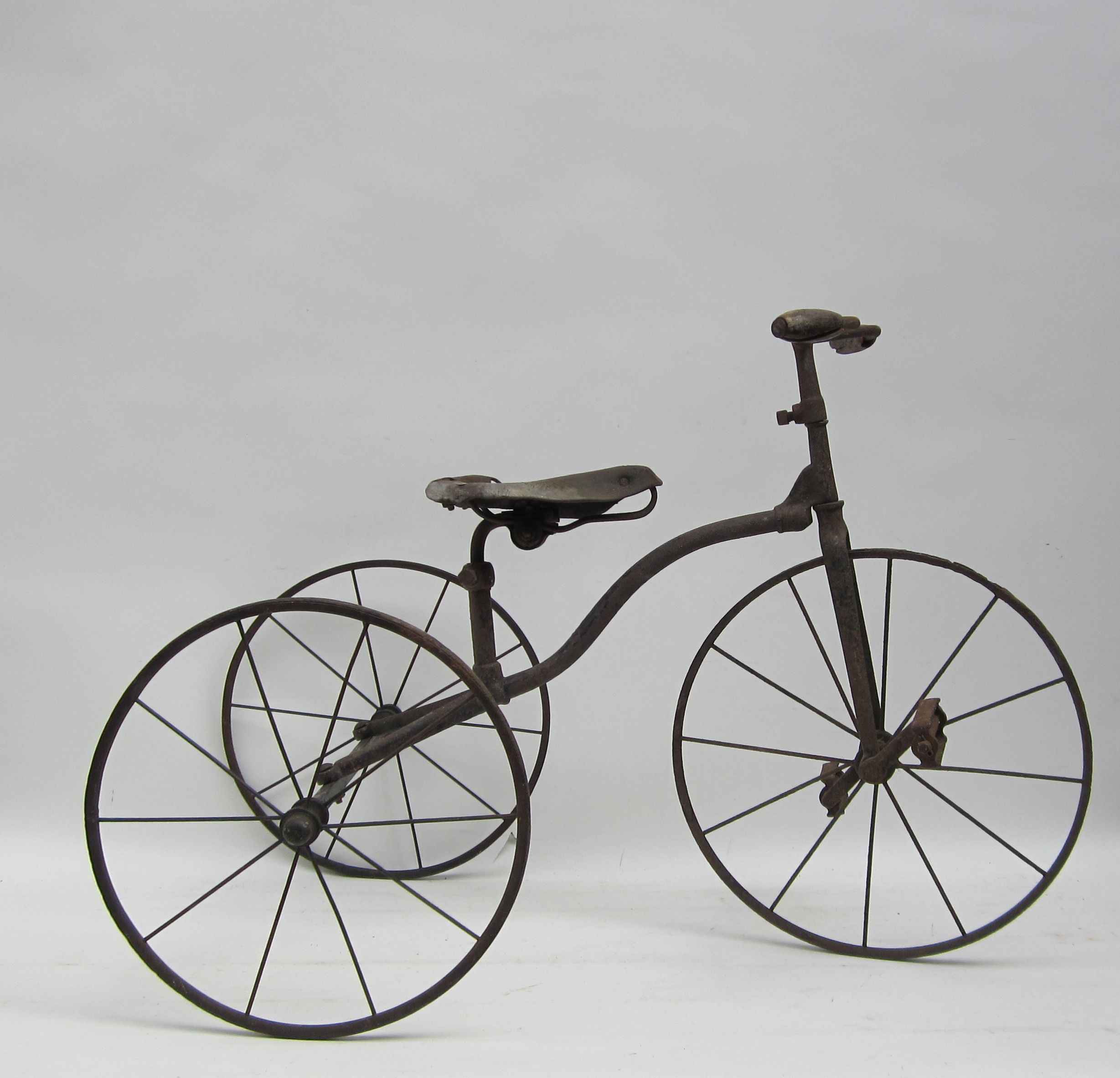 Bonhams Cars : A Child's solid tyre tricycle and other cycling spares,