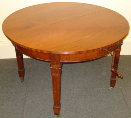 Bonhams : A reproduction mahogany extending dining table, in late 19th ...