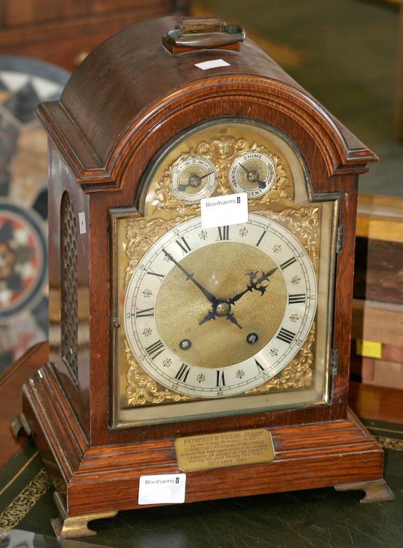 Bonhams : An Edwardian oak, domed top, striking and chiming bracket clock