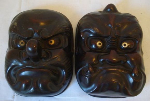 Bonhams : A pair of Japanese carved hardwood masks, with shell inset ...