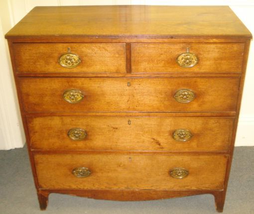 Bonhams : A George III oak chest, the reeded edge top above two short ...