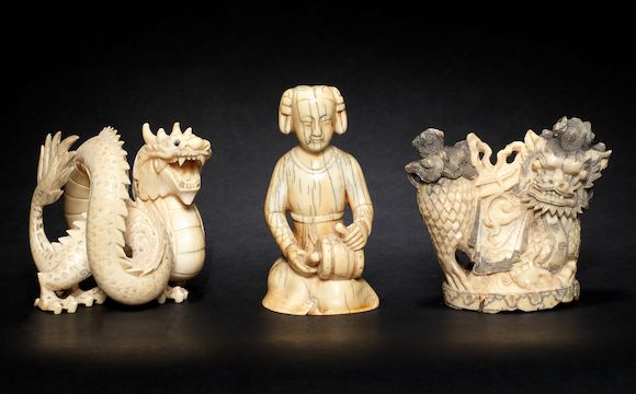 Bonhams : Two small carved ivory figures,