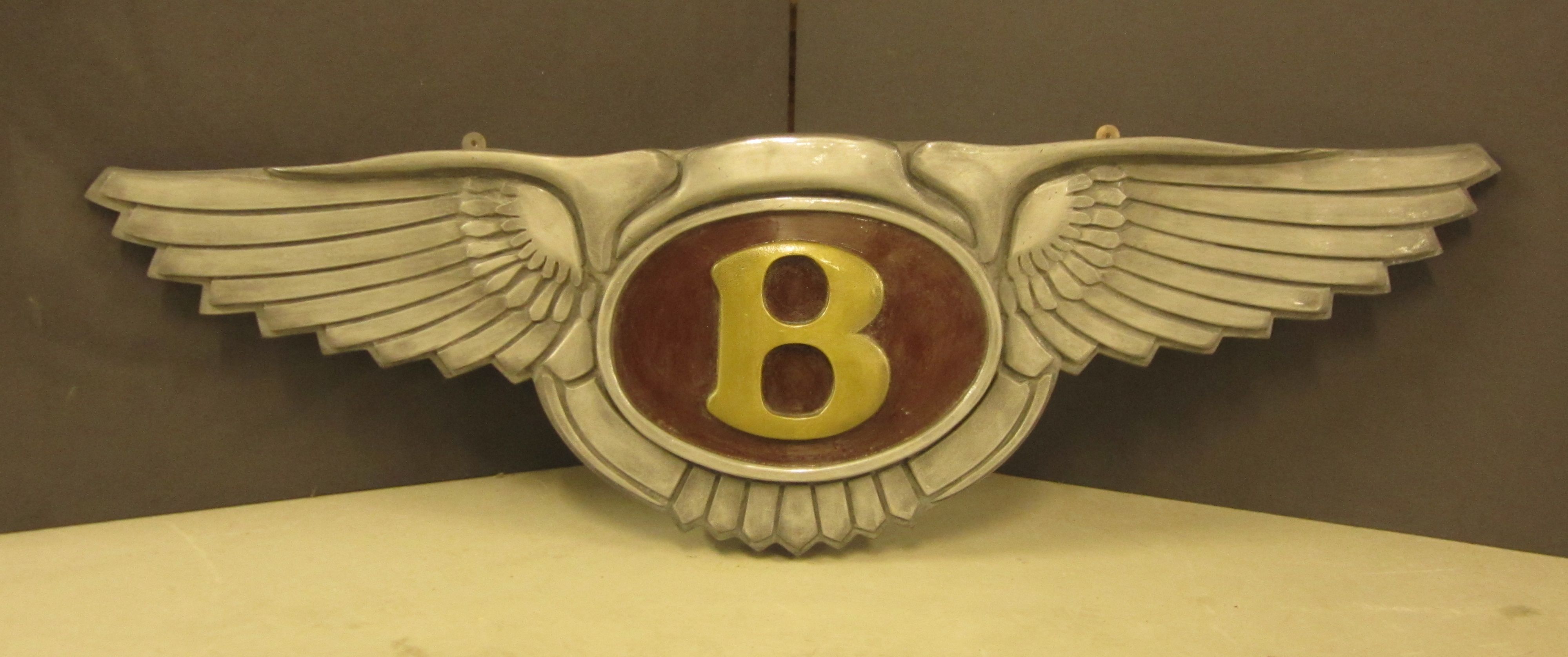 Bonhams Cars : A winged Bentley emblem,