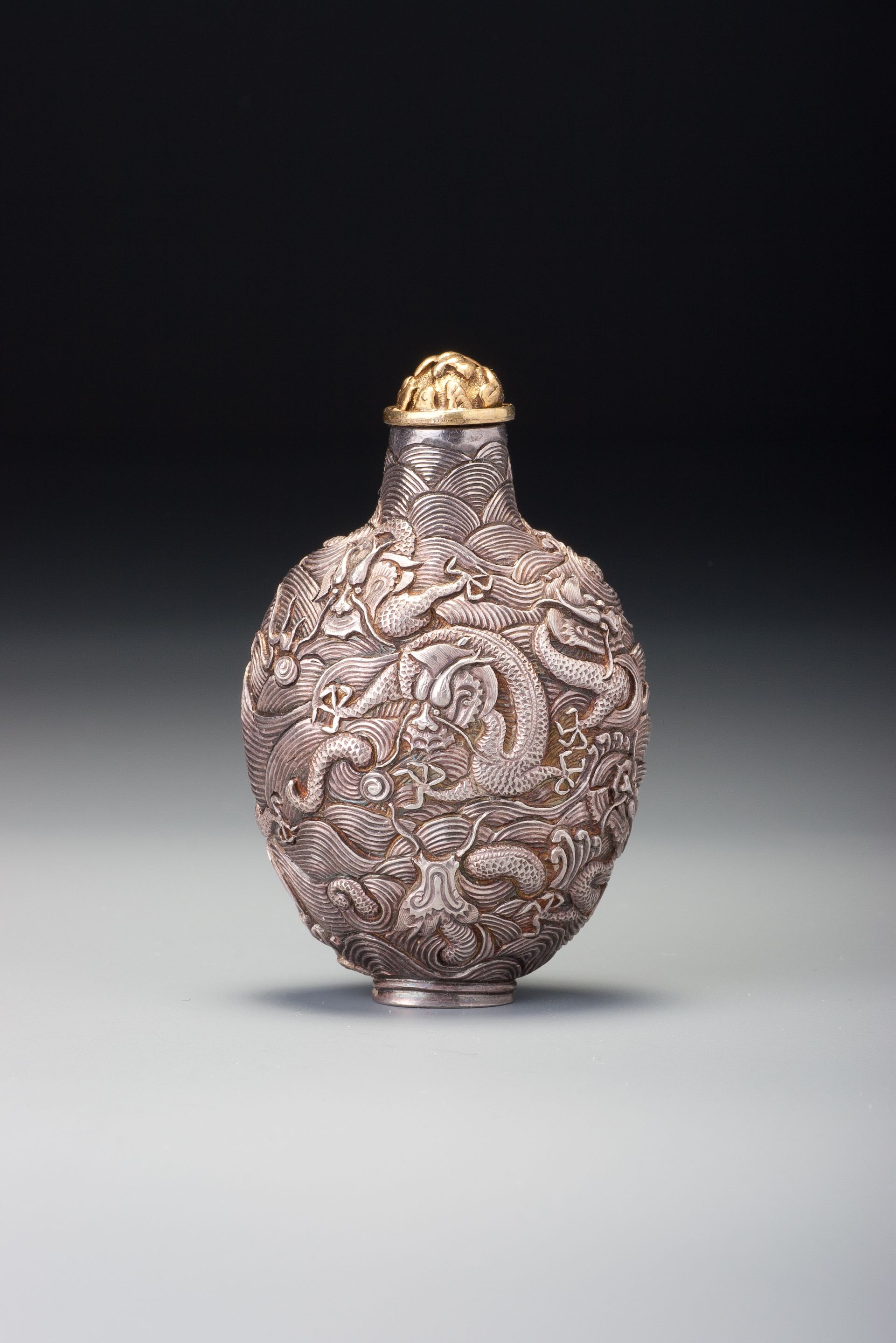 Bonhams : A silver 'nine dragons' snuff bottle Yuanxin, 1760-1850