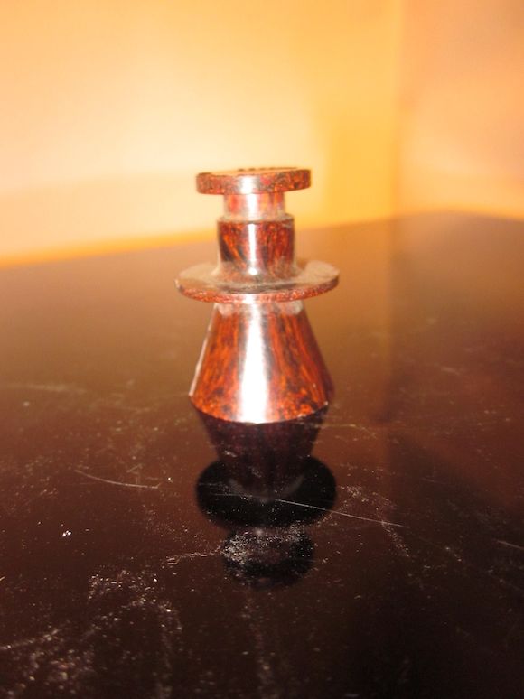 Bonhams : A rare brown Bakelite sand tee mould with plunger
