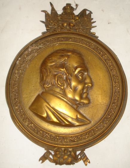 Bonhams : A cast bronze circular plaque, centred with a profile of the ...