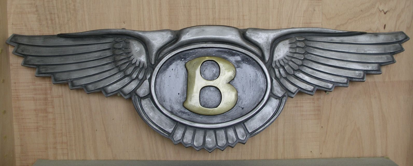 Bonhams Cars : A 'Bentley' garage display emblem,