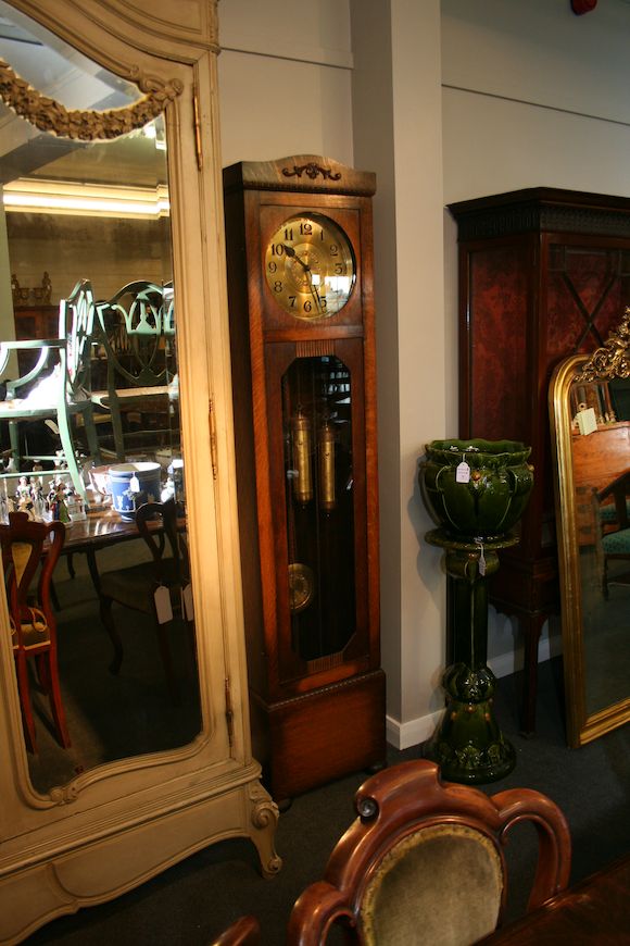 Bonhams : An 1930's oak long cased clock with Westminster chimes