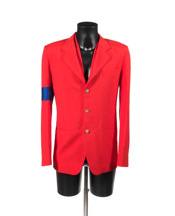 Bonhams : A red jacket with blue arm band,