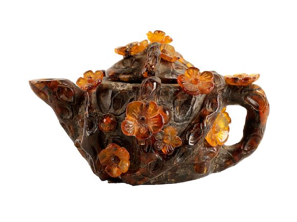 Bonhams : A Chinese amber miniature teapot and cover,