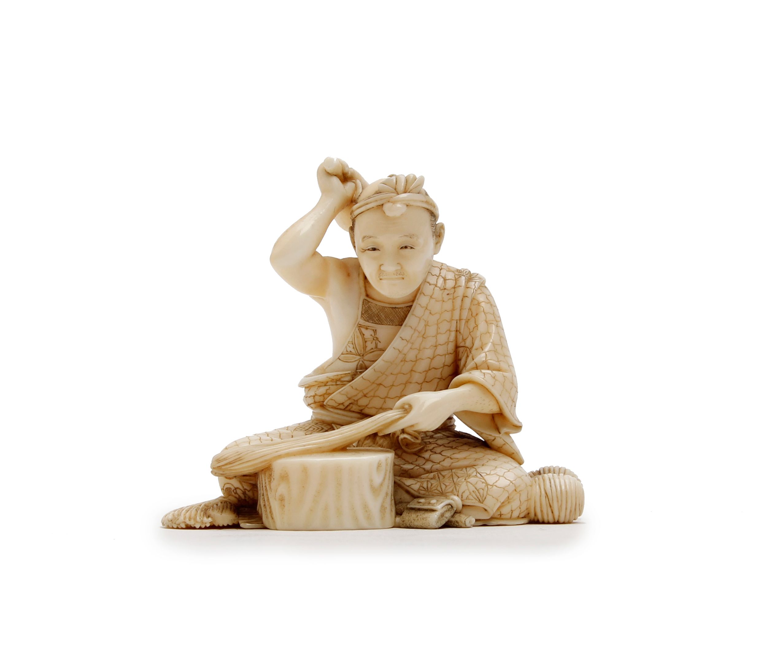 Bonhams : A Japanese carved ivory figure of a beater Meiji period