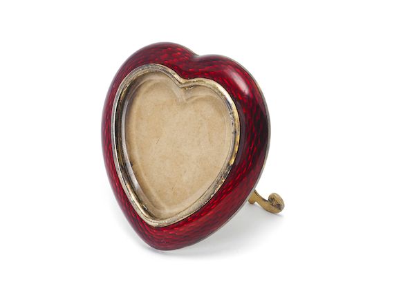Bonhams : A red enamelled miniature heart-shaped photograph frame with ...