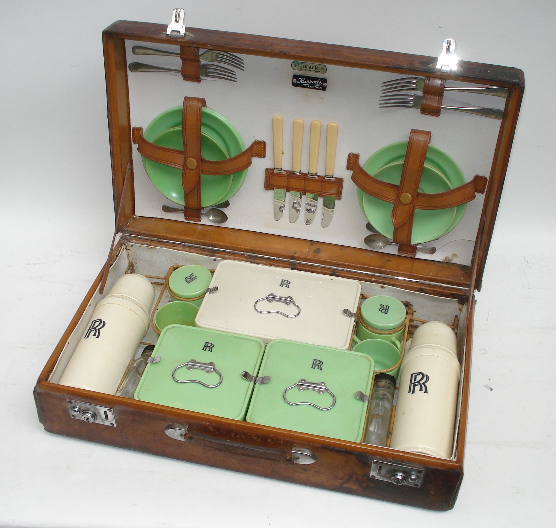 Bonhams Cars : A leather-cased 'Coracle' four-person picnic set for ...