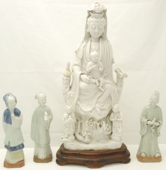 Bonhams : A large blanc de chine Guanyin and three celadon figures Late ...