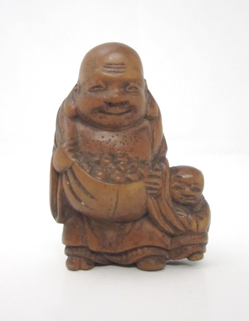 Bonhams : A carved wood netsuke Probably 19th century