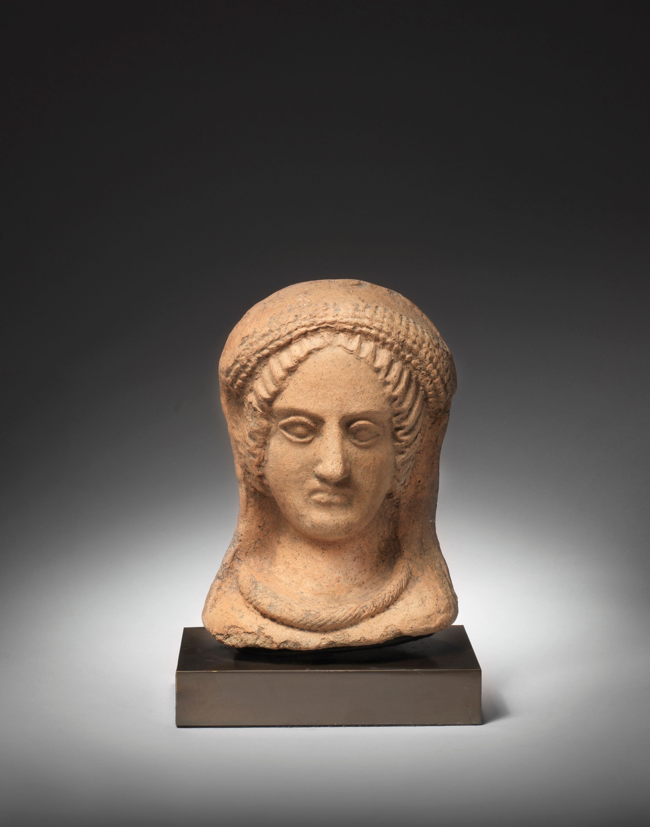 Bonhams : An Etruscan terracotta votive female head