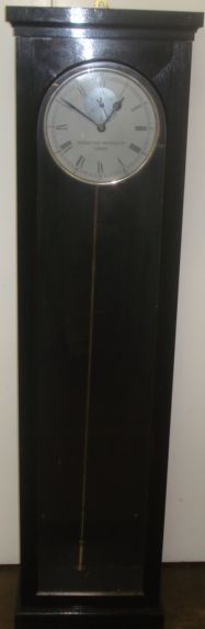 Bonhams : An ebonised oak case electric wall clock, the circular dial ...