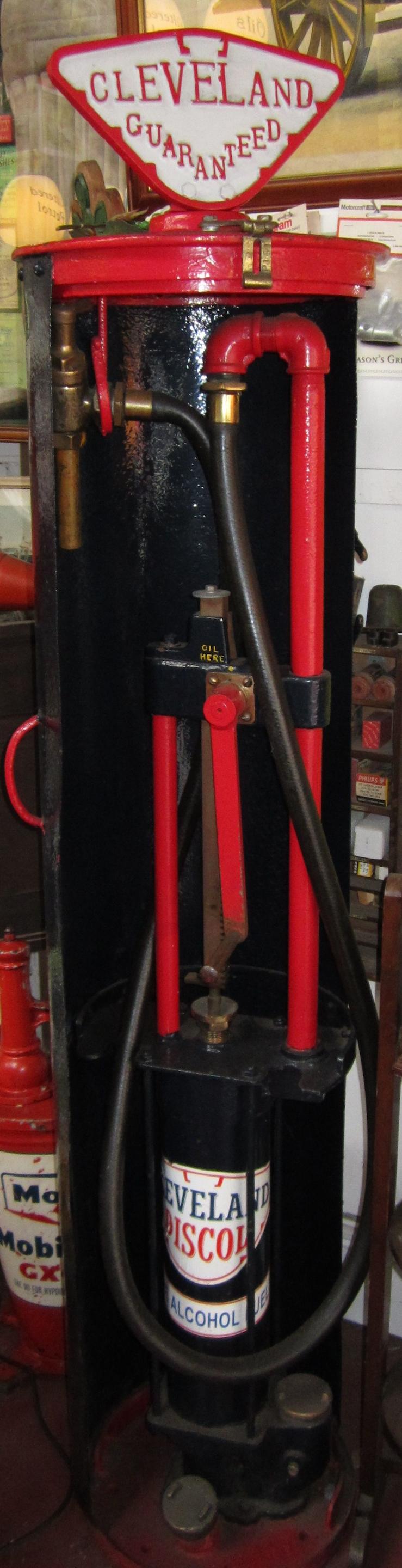 Bonhams Cars : A skeleton hand-cranked petrol pump in a 'pillar box' cover,