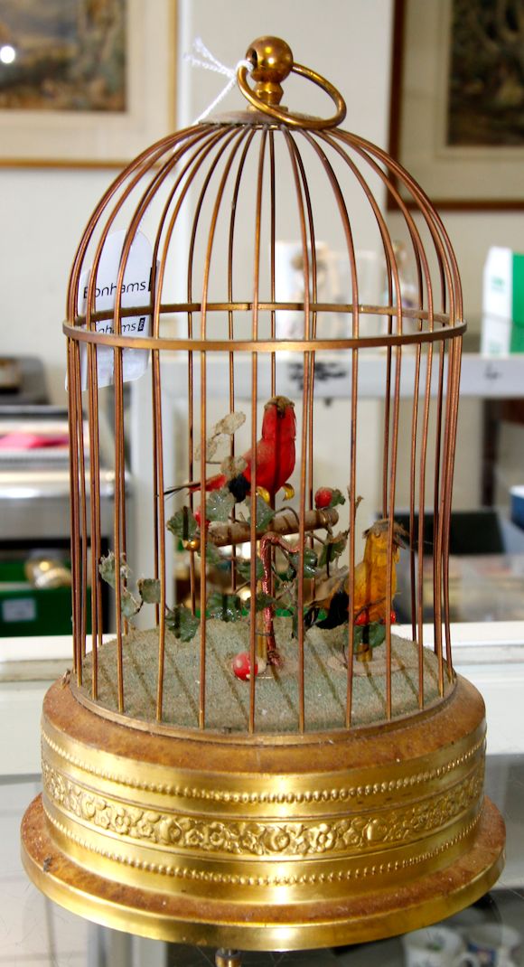 Bonhams : A 1950's singing bird automaton,the cage containing two birds ...