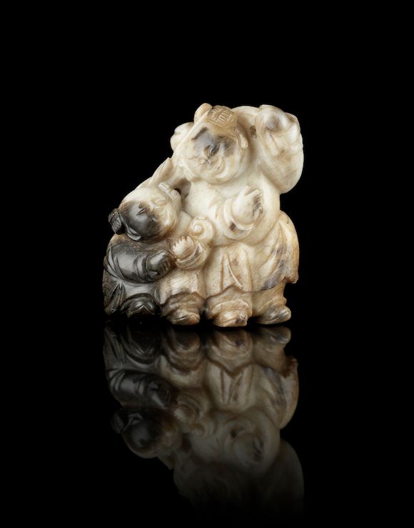Bonhams : A mottled white and black jade carving of the Hehe Erxian ...