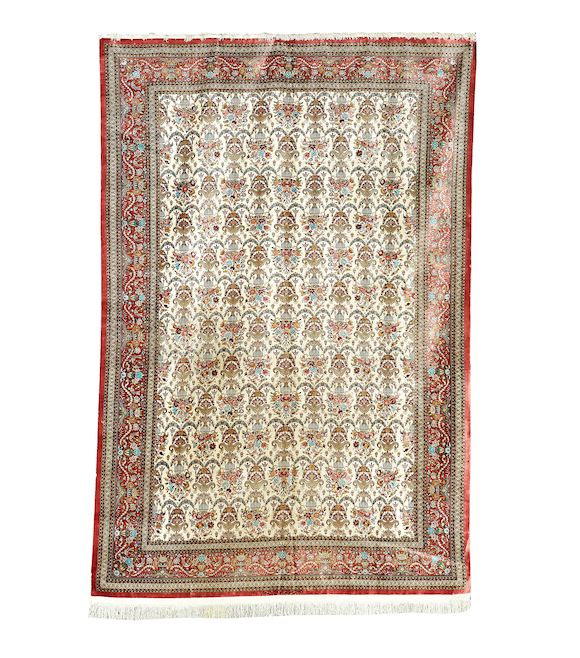 Bonhams : A silk Ghom carpet, Central Persia, 350cm x 240cm, signed