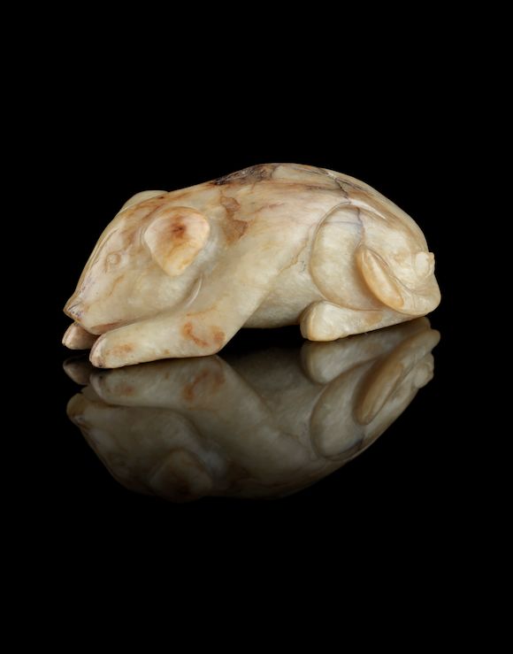 Bonhams : A mottled jade pig plug