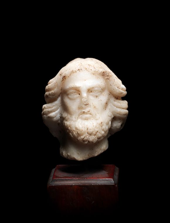 Bonhams : A small Hellenistic marble head of Asklepios