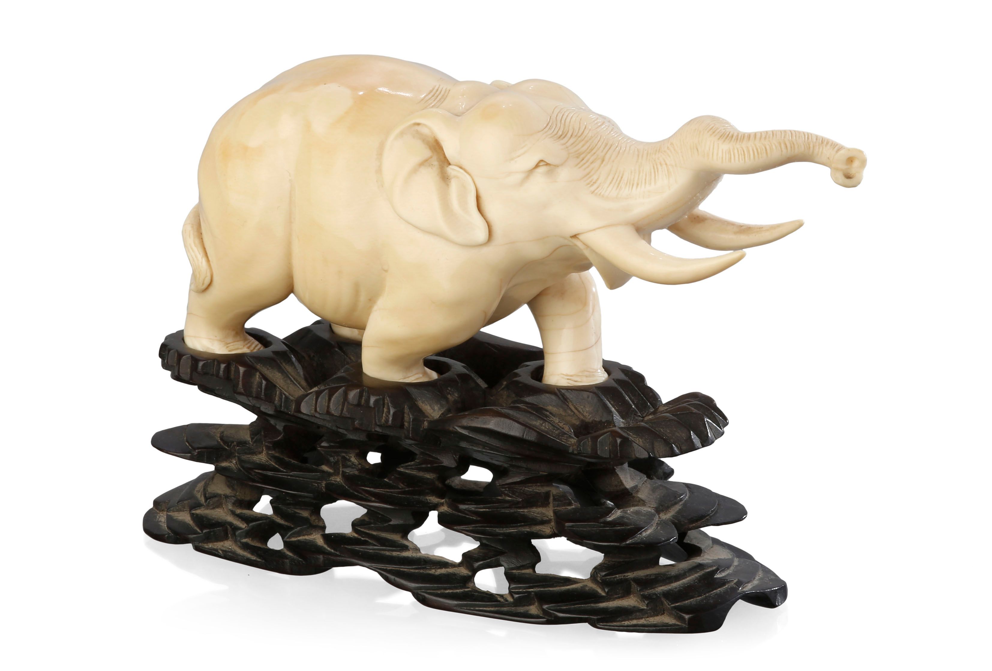 Bonhams : A Japanese ivory carving of a bellowing elephant