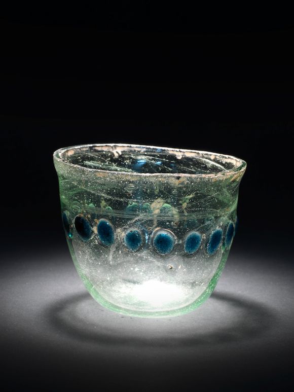 Bonhams : A Roman pale green glass cup
