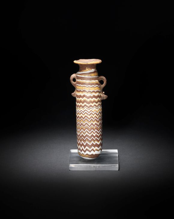 Bonhams : A Greek brown core-formed glass alabastron
