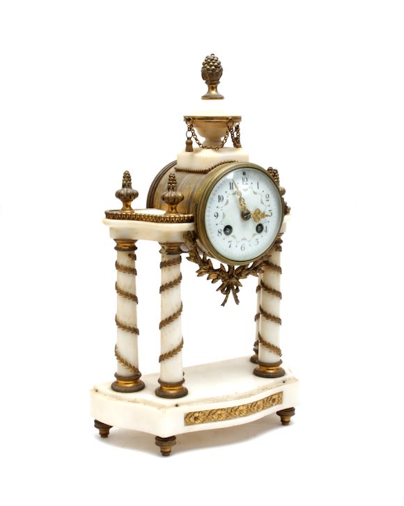 Bonhams : A late Victorian four pillar marble mantel clock