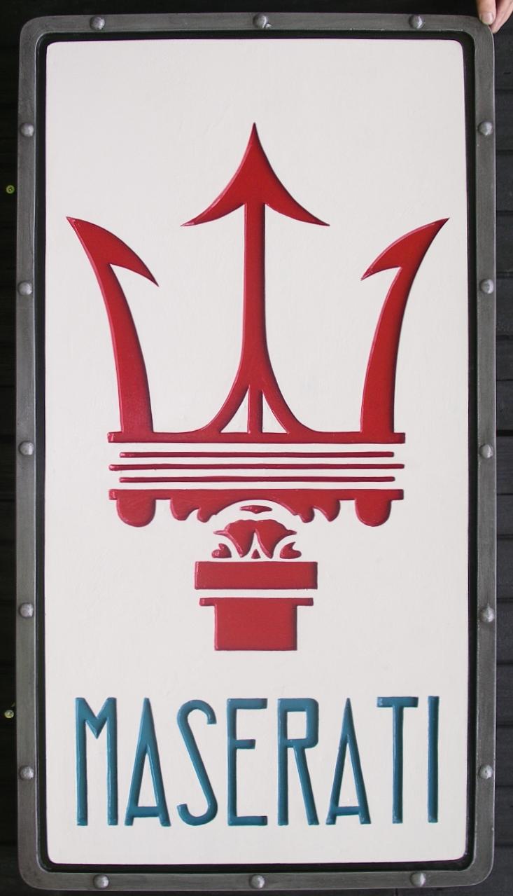 Bonhams Cars : A Maserati garage display emblem,