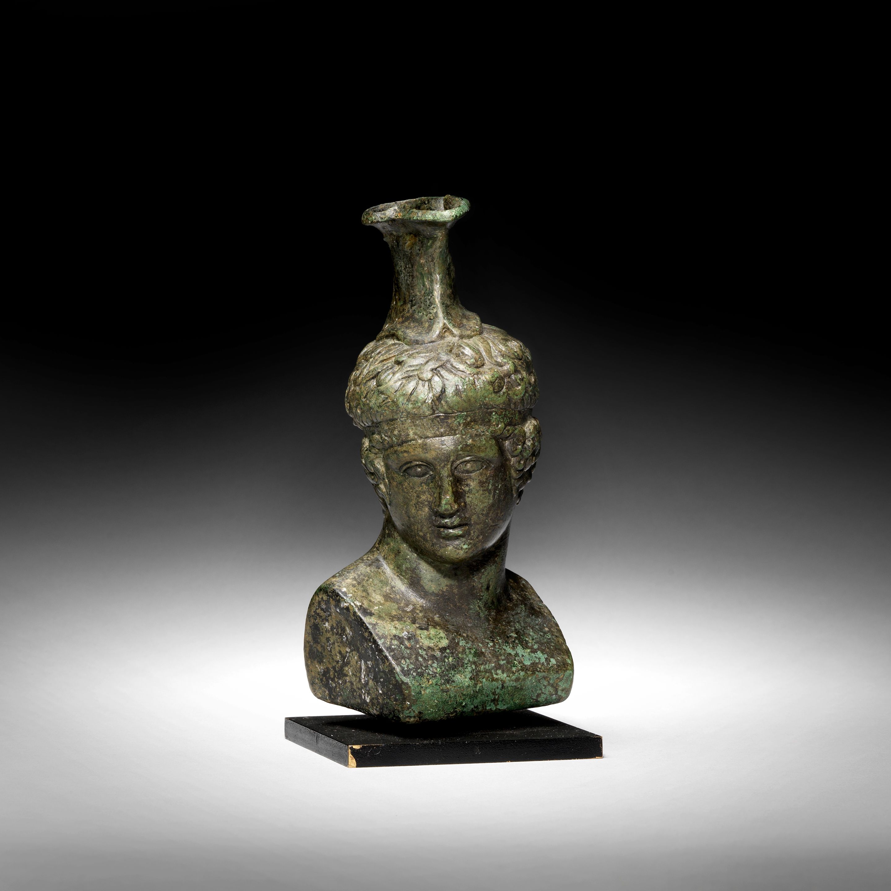 Bonhams : A Roman bronze balsamarium of the Diadoumenos