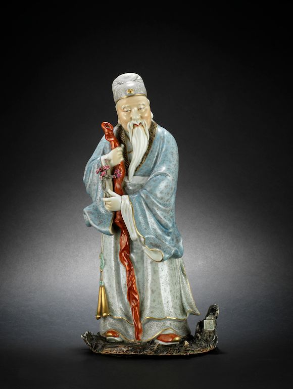 Bonhams : A glazed figure of a standing scholar Four-character mark