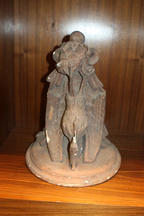 Bonhams : A composition stone cupid capital,