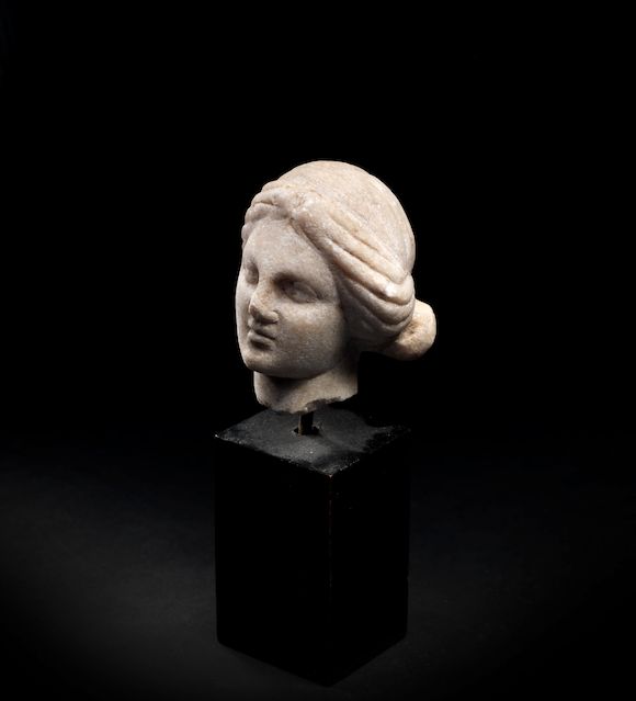 Bonhams : A small Hellenistic marble head of a goddess