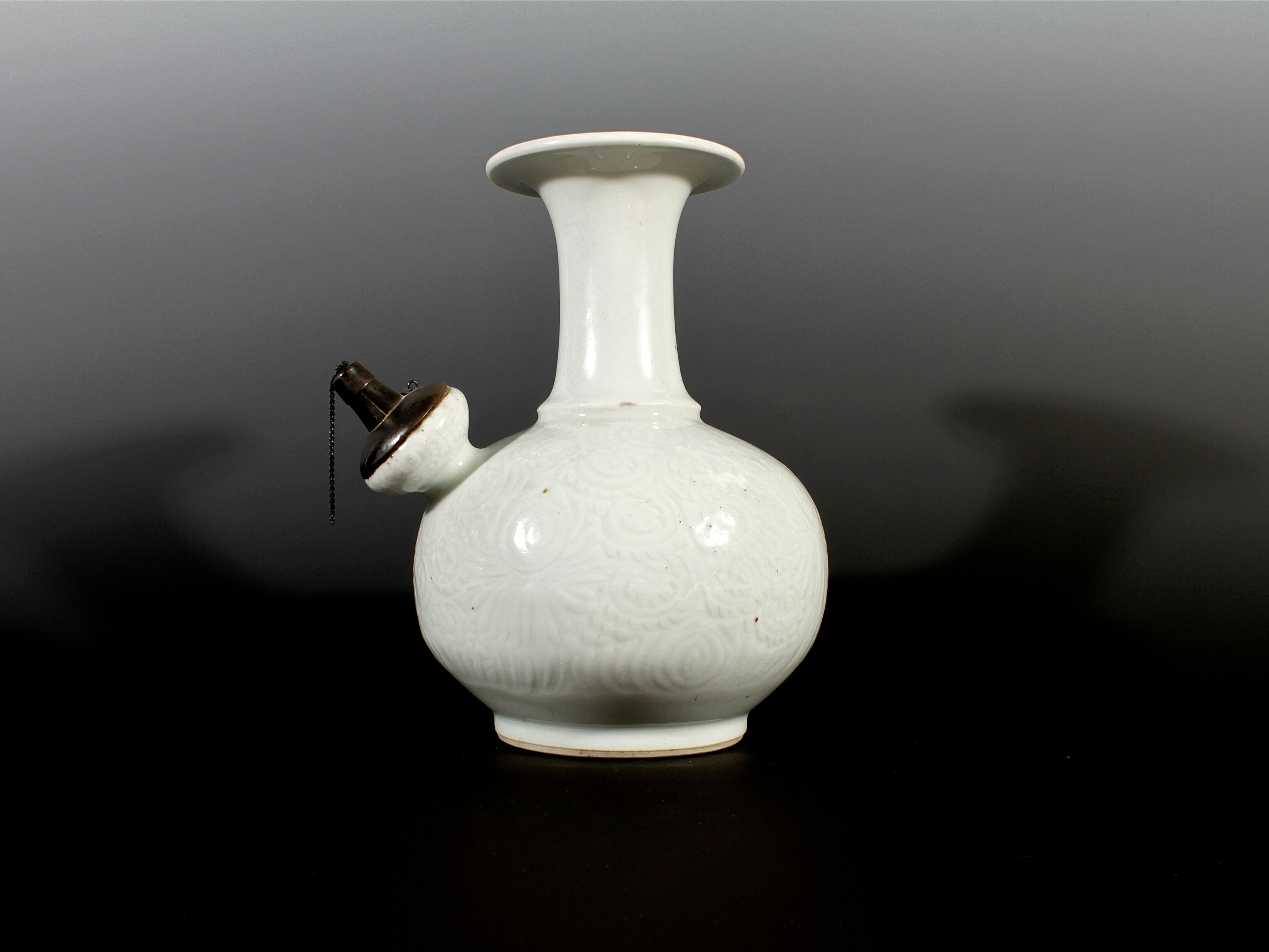 Bonhams : A pale blue glazed carved kendi, 17th century