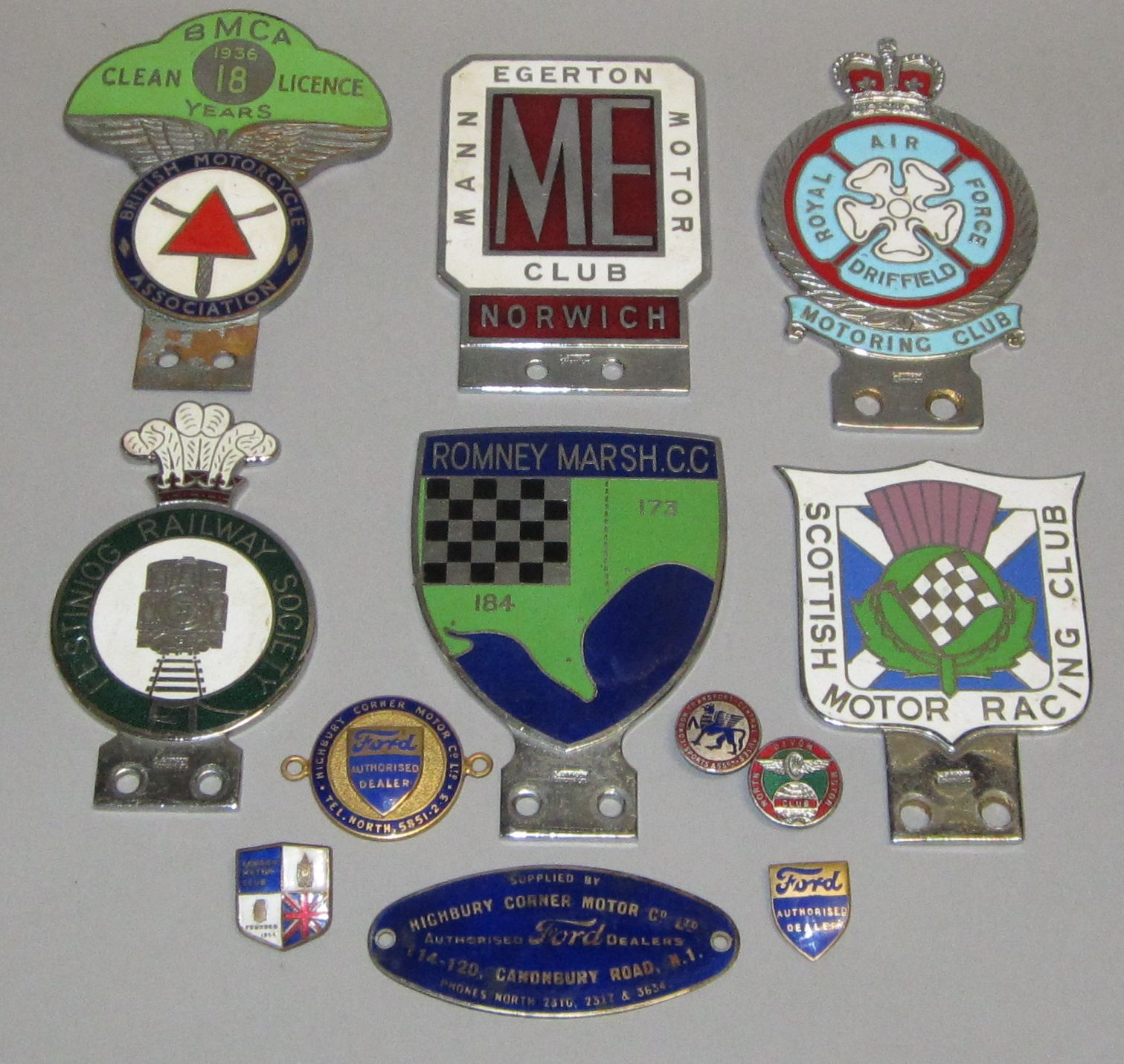 Bonhams Cars : Six enamel motoring badges and six smaller badges,