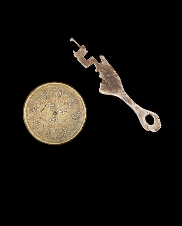 Bonhams : A Byzantine bronze inlaid disc weight and a Byzantine silver ...