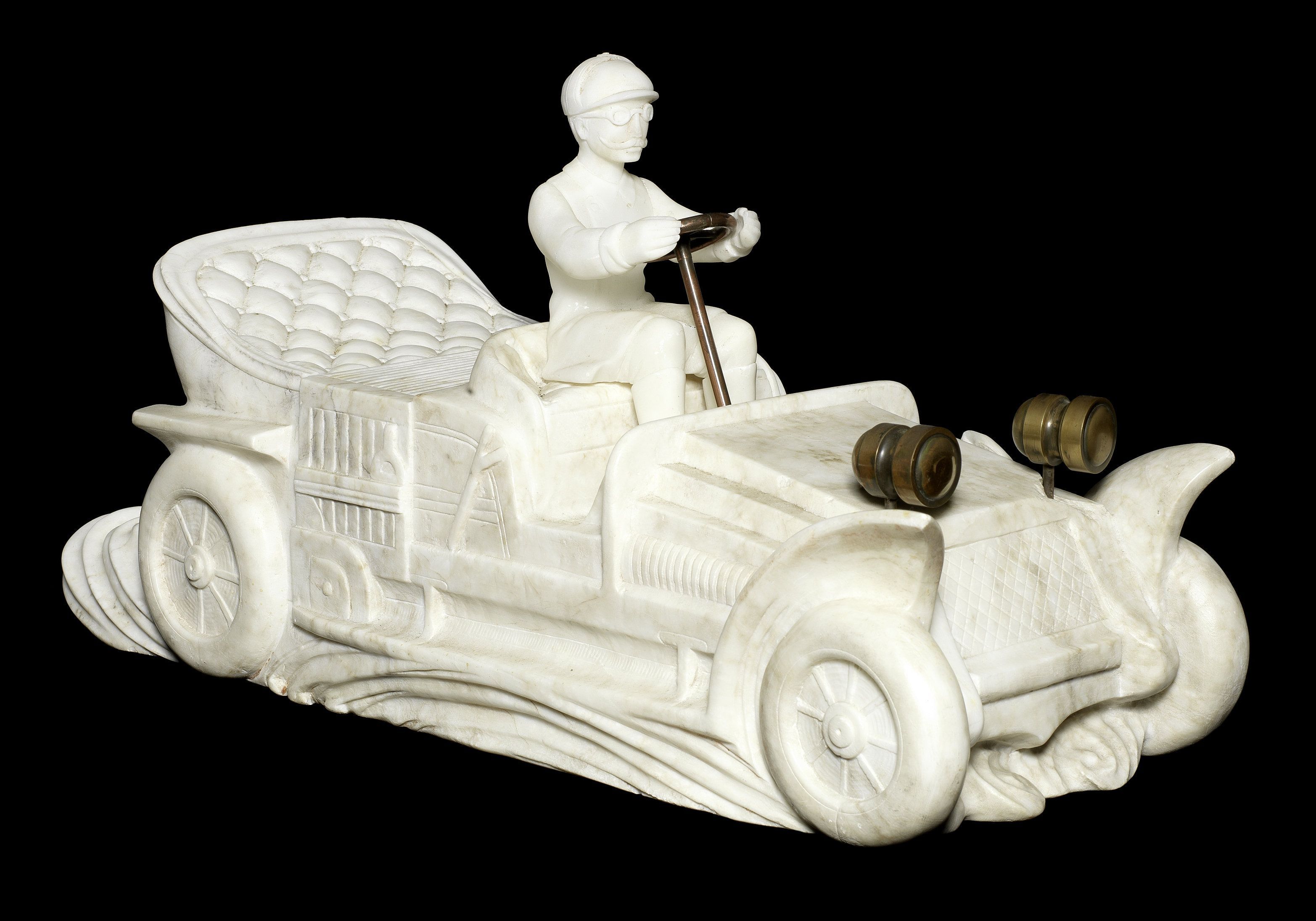 Bonhams Cars : An alabaster statue of an early motorcar,