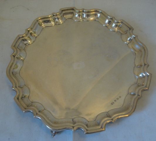 Bonhams : A circular silver salver, with 'Chippendale' border on three ...