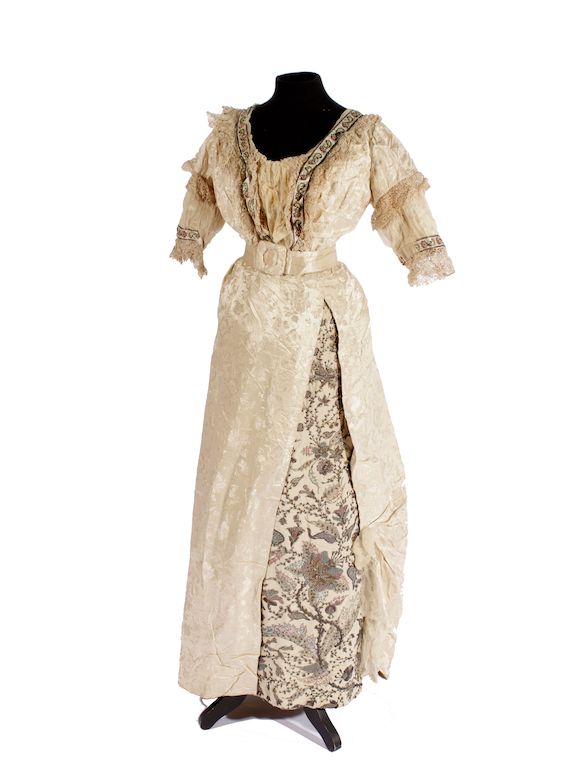 Bonhams : A circa 1900 cream damask silk evening dress