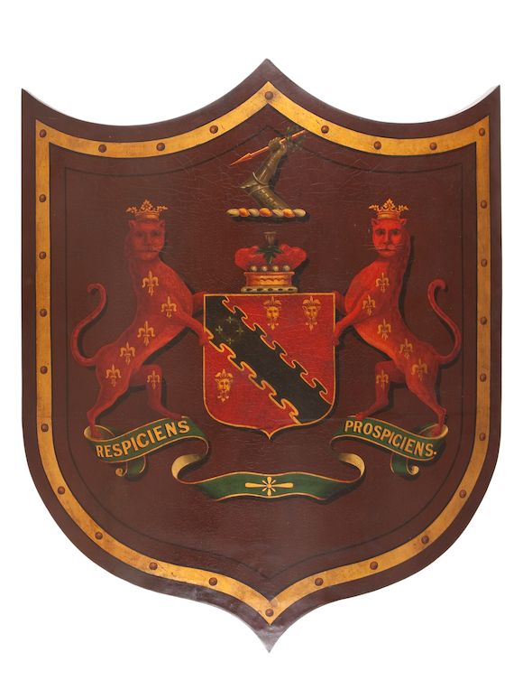 Bonhams : A large painted and gilded tin shield shaped armorial