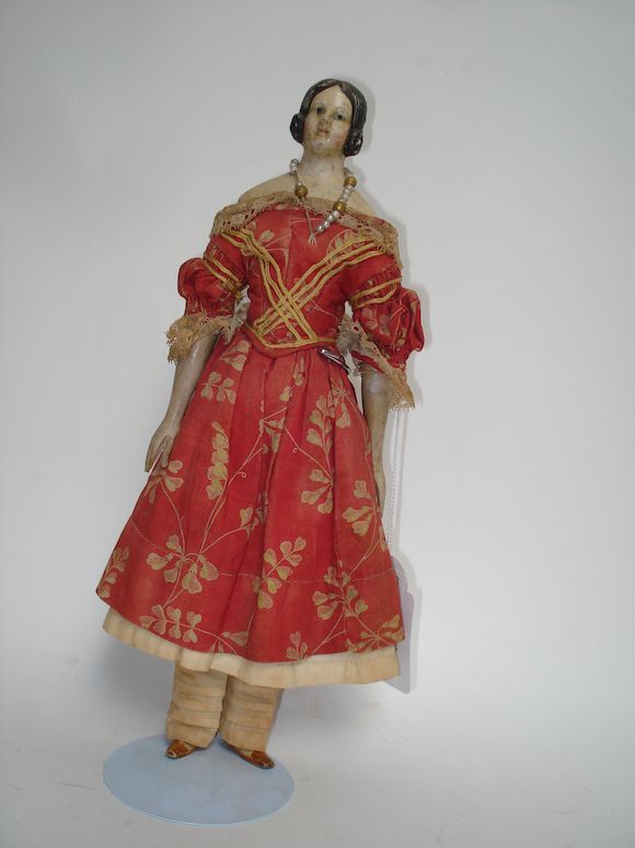 Bonhams : Early papier-mache shoulder head doll, circa 1840