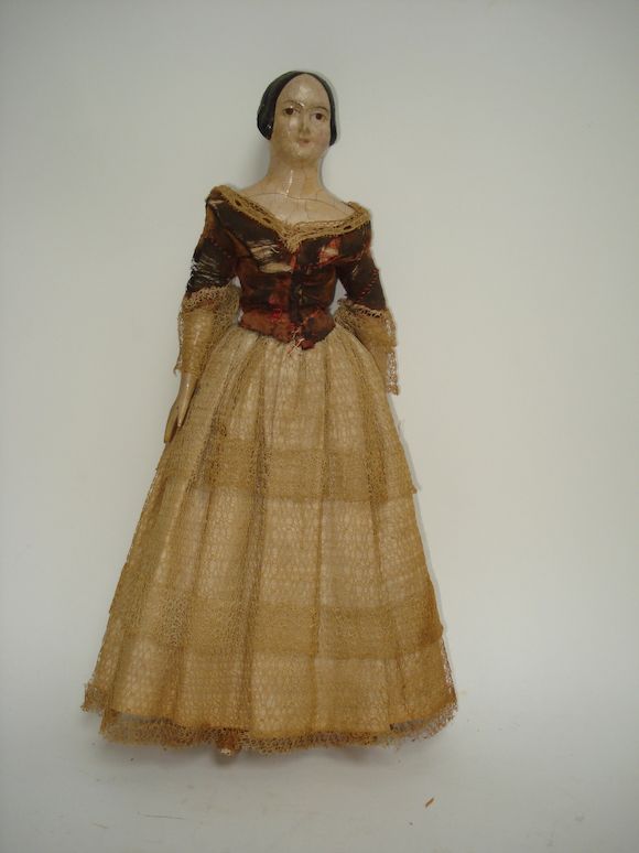 Bonhams : Early papier-mache shoulder head doll, circa 1840