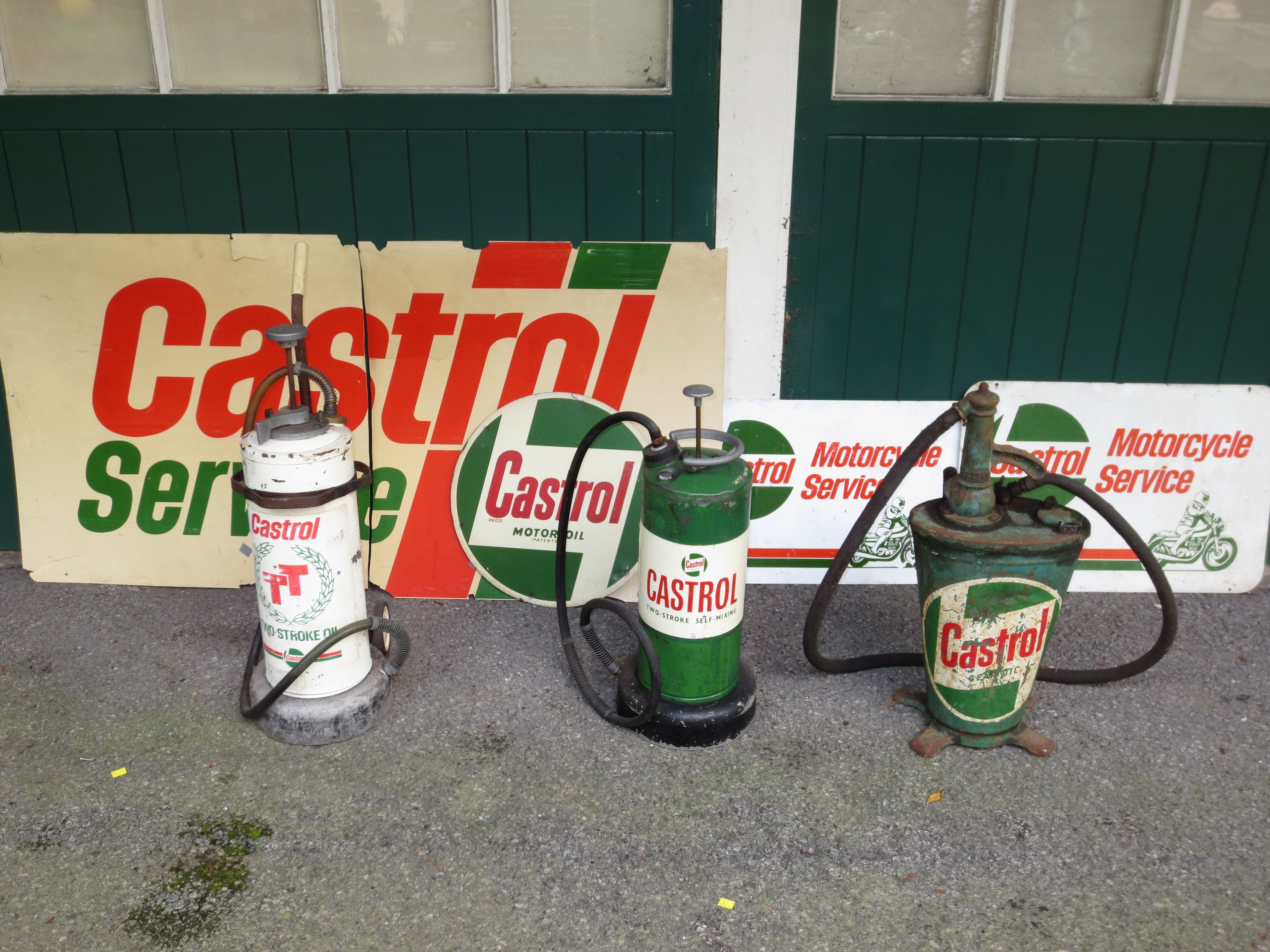 Bonhams Cars : Three Castrol oil dispensers,