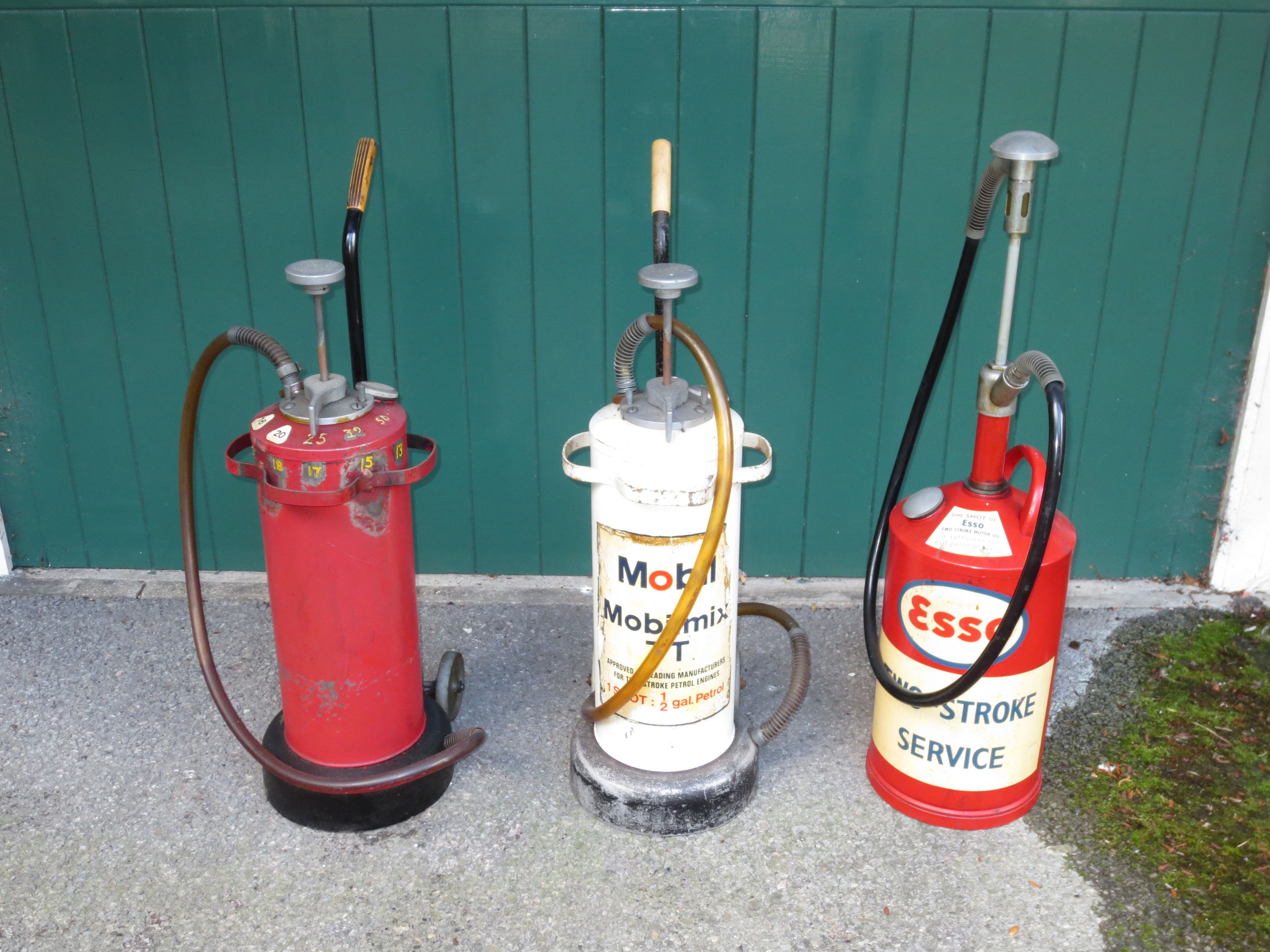 Bonhams Cars : Three 2-stroke motorcycle oil dispensers,