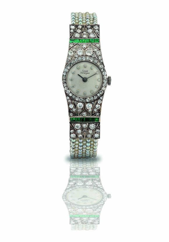 Bonhams : An 18ct white gold, seed pearl, emerald and diamond set lady ...